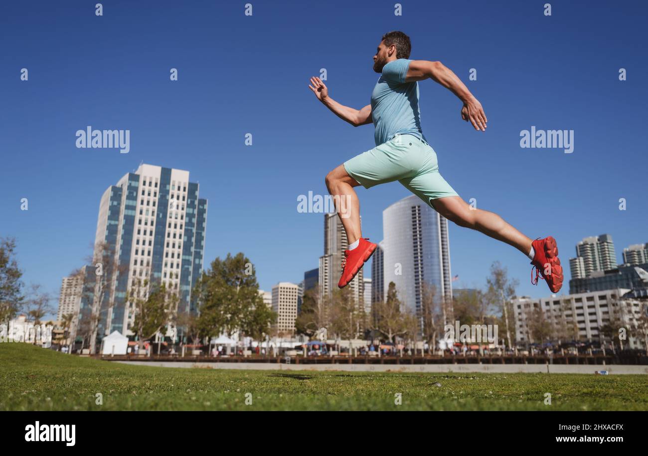 Athletic young man running in city. Dynamic jumping movement. Young and ...