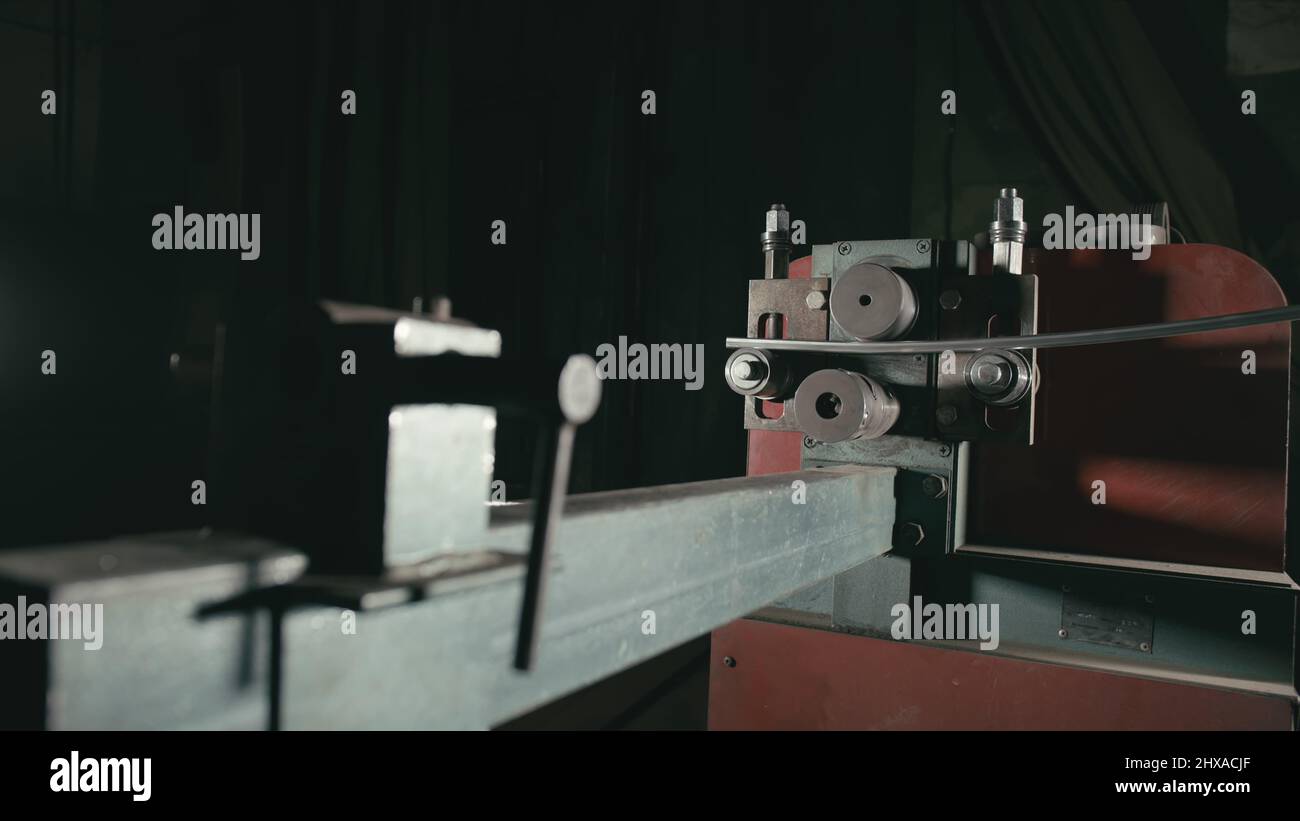 Forge workshop on table. Smithy manual production. Worker bends the ...