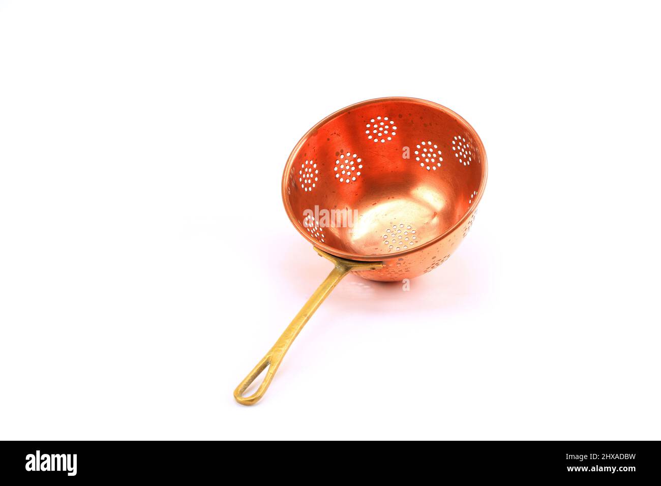 Vintage copper colander white Background Stock Photo - Alamy