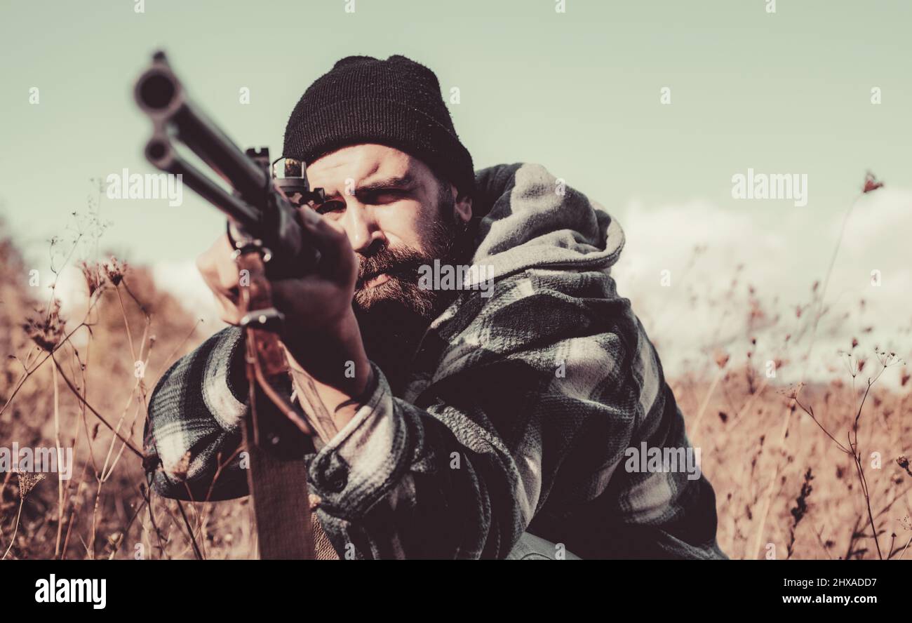 Hunting in America. Hunter with shotgun gun on hunt. Hunter aiming ...