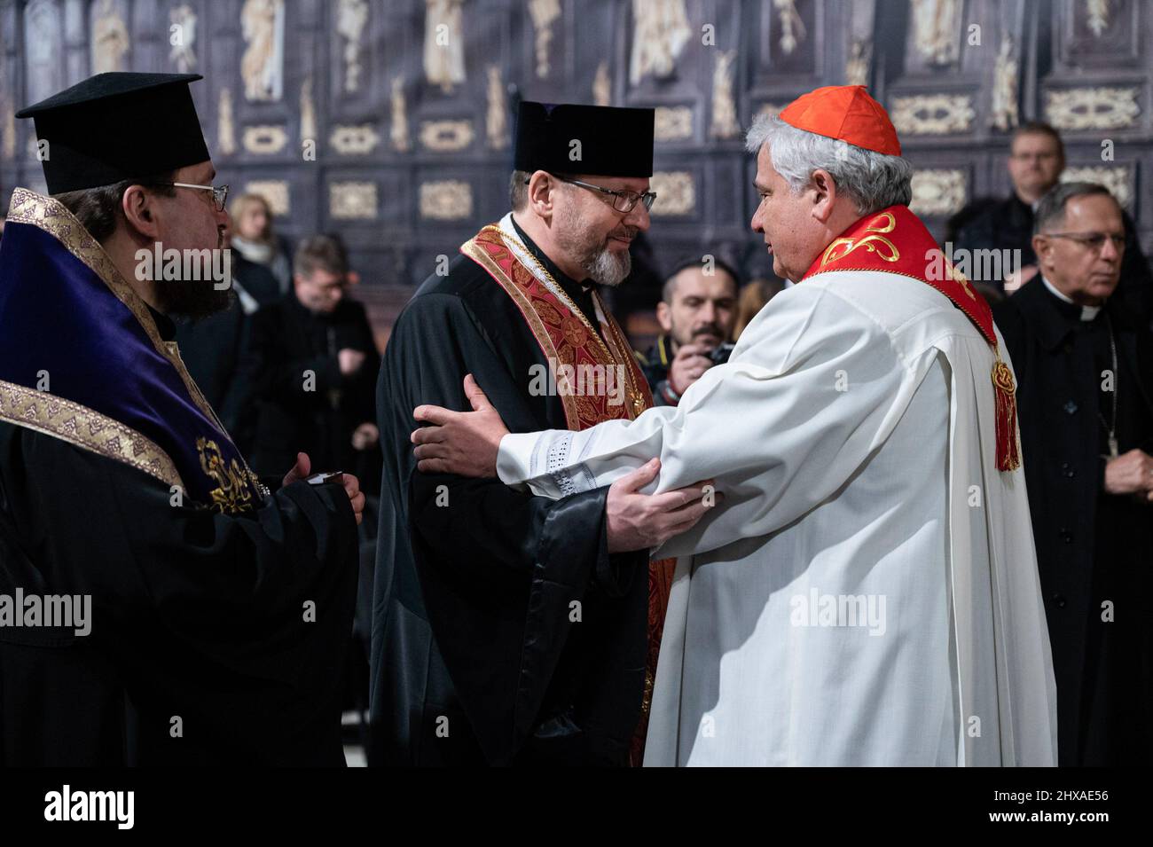 Lviv, Ukraine. 10th Mar, 2022. Cardinal Konrad Krajewsk (R) seen ...