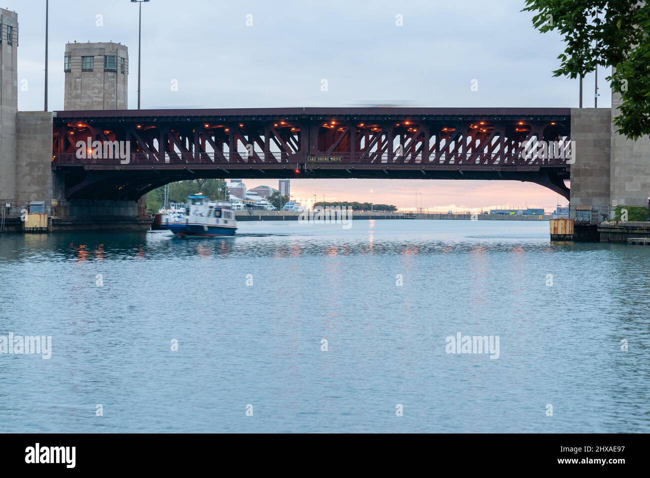 Lake Shore Drive bridge in silhouette across Chicago River with sunset ...