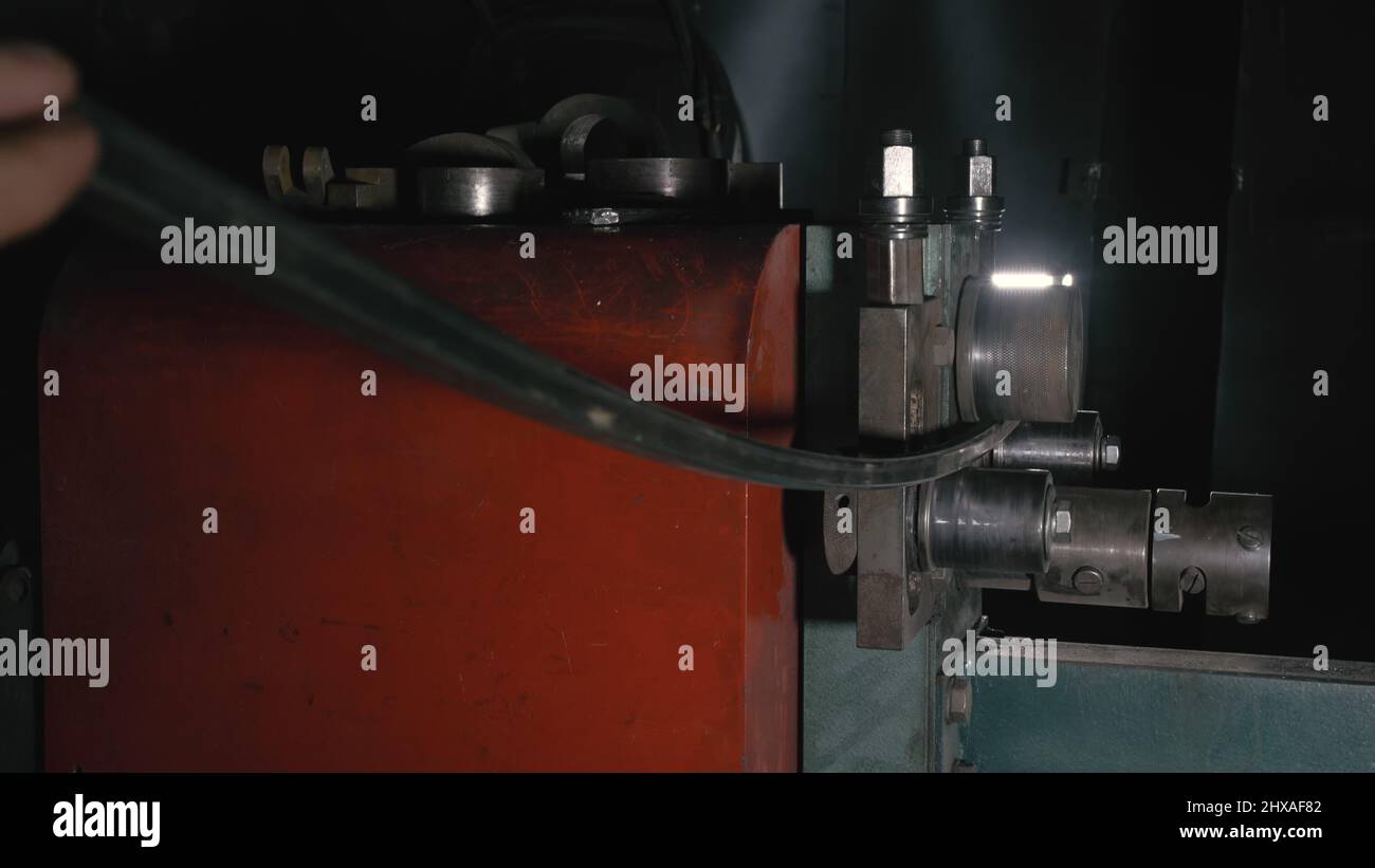 Forge workshop on table. Smithy manual production. Worker bends the ...