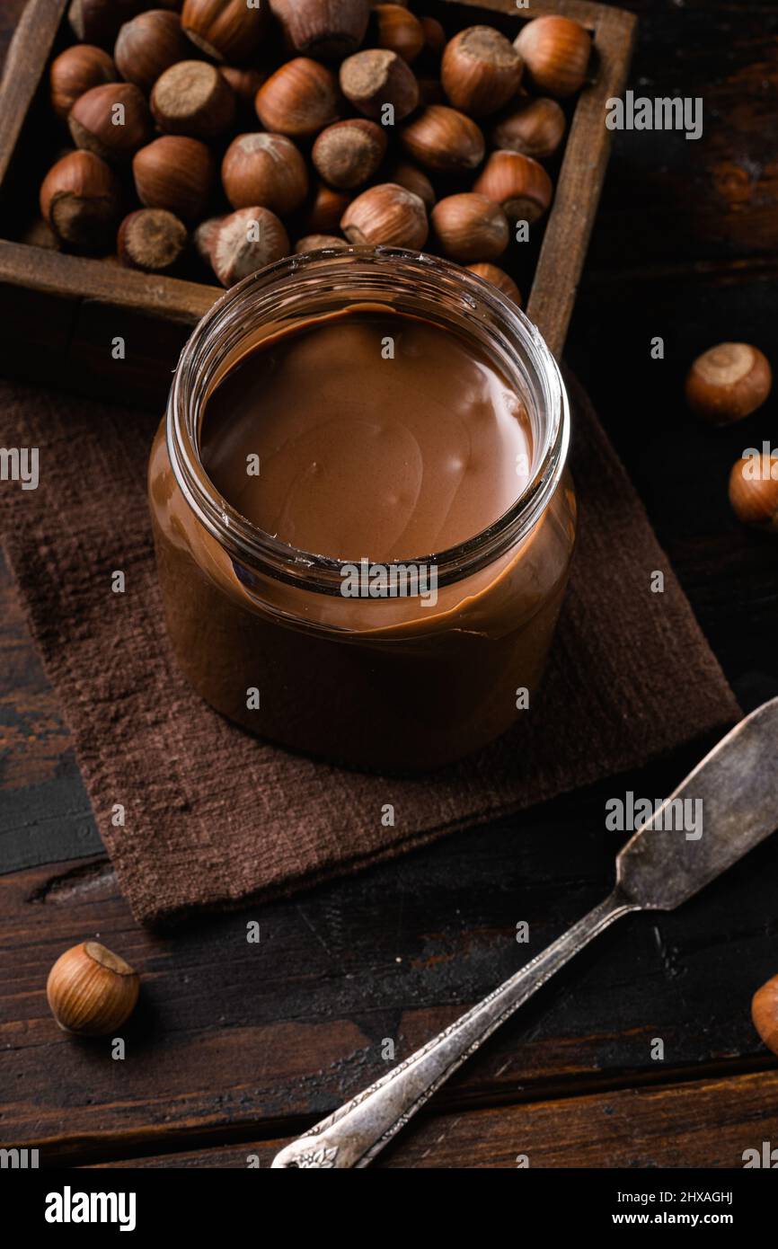 Sweet hazelnut spread set, on old dark wooden table background Stock ...