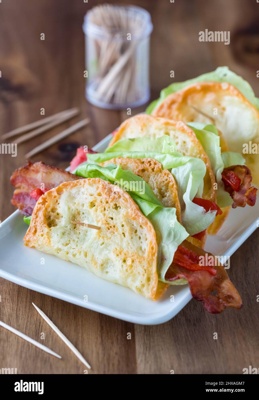 A small platter of provolone crisp appetizer wraps, ready for eating ...