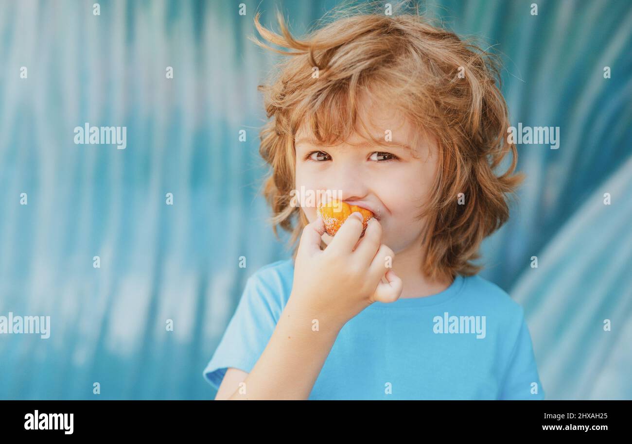 Kid eating cookies outdoors. Child eats biscuit. Kids lunch Stock Photo ...