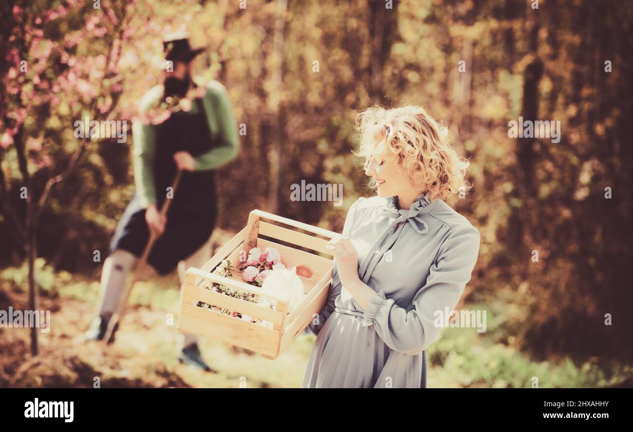 Lifestyle and family life. Image of two happy farmers with instruments ...