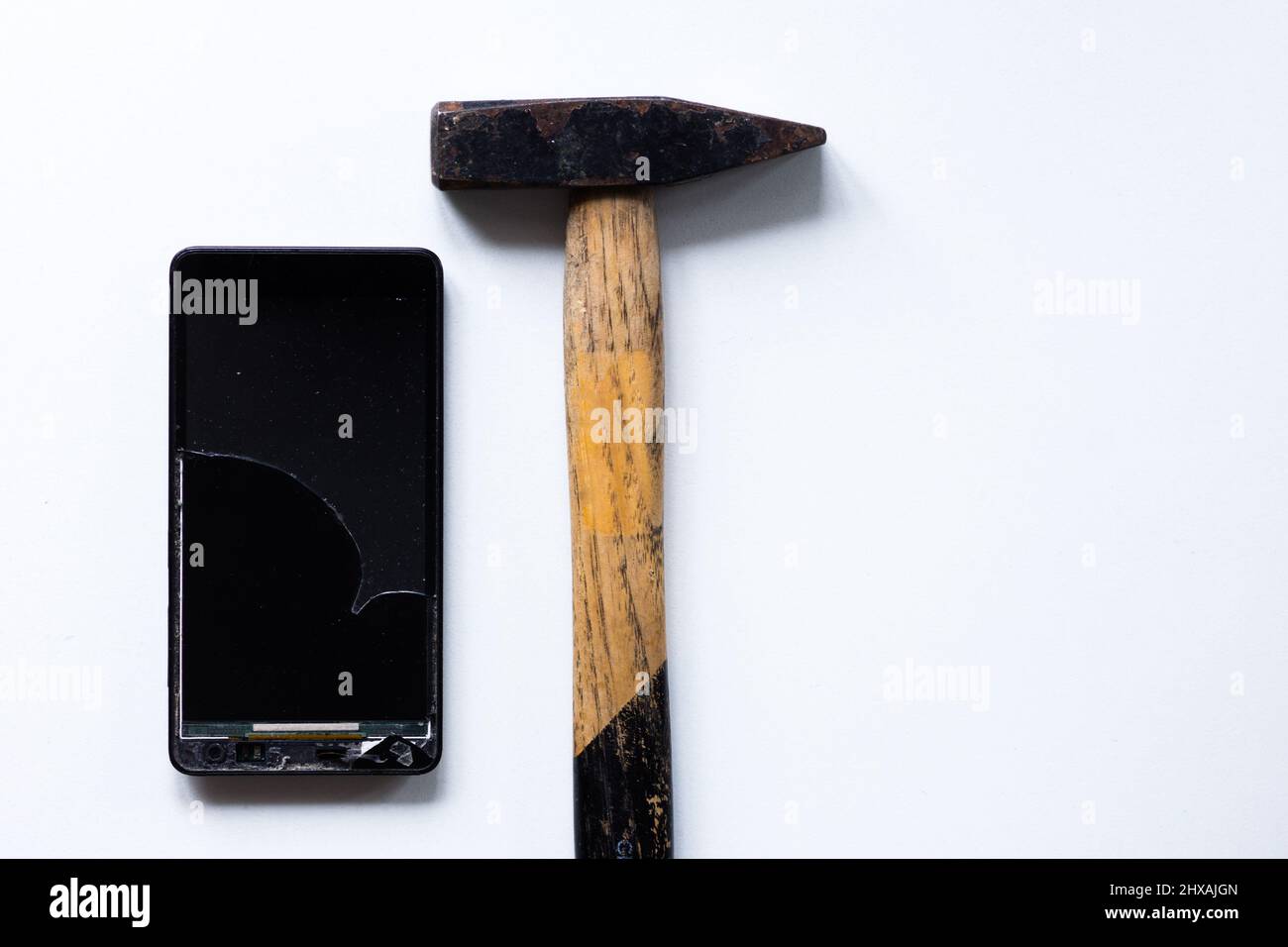 Old broken mobile phone hammer hi-res stock photography and images - Alamy