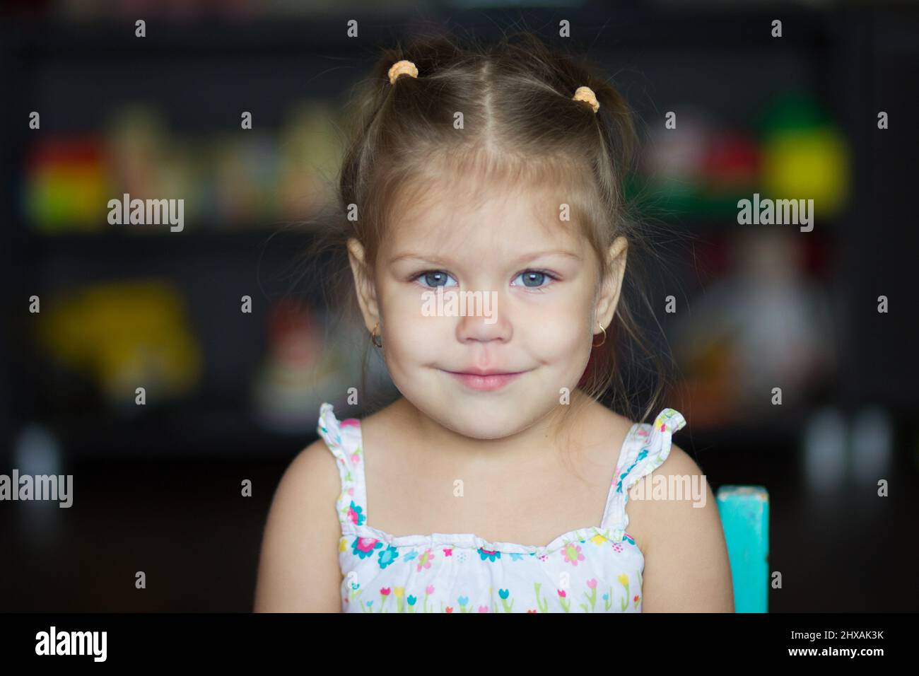 Portrait of the cute little girl looking at camera Stock Photo - Alamy