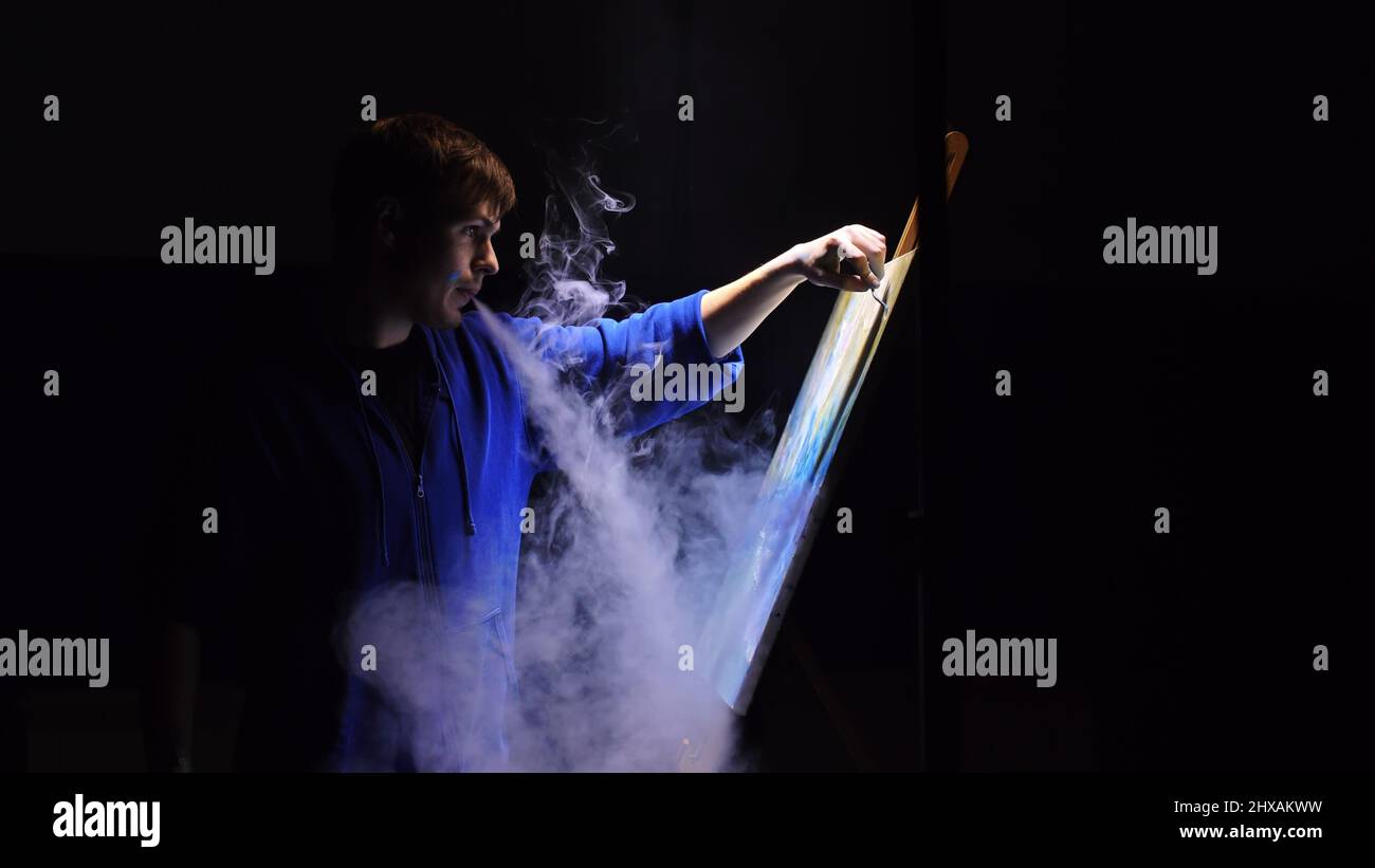 Artist copyist paint seascape with ship in ocean. Vaper smoke vape e ...