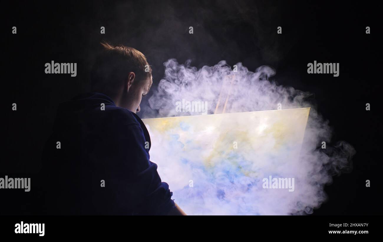 Artist copyist paint seascape with ship in ocean. Vaper smoke vape e ...