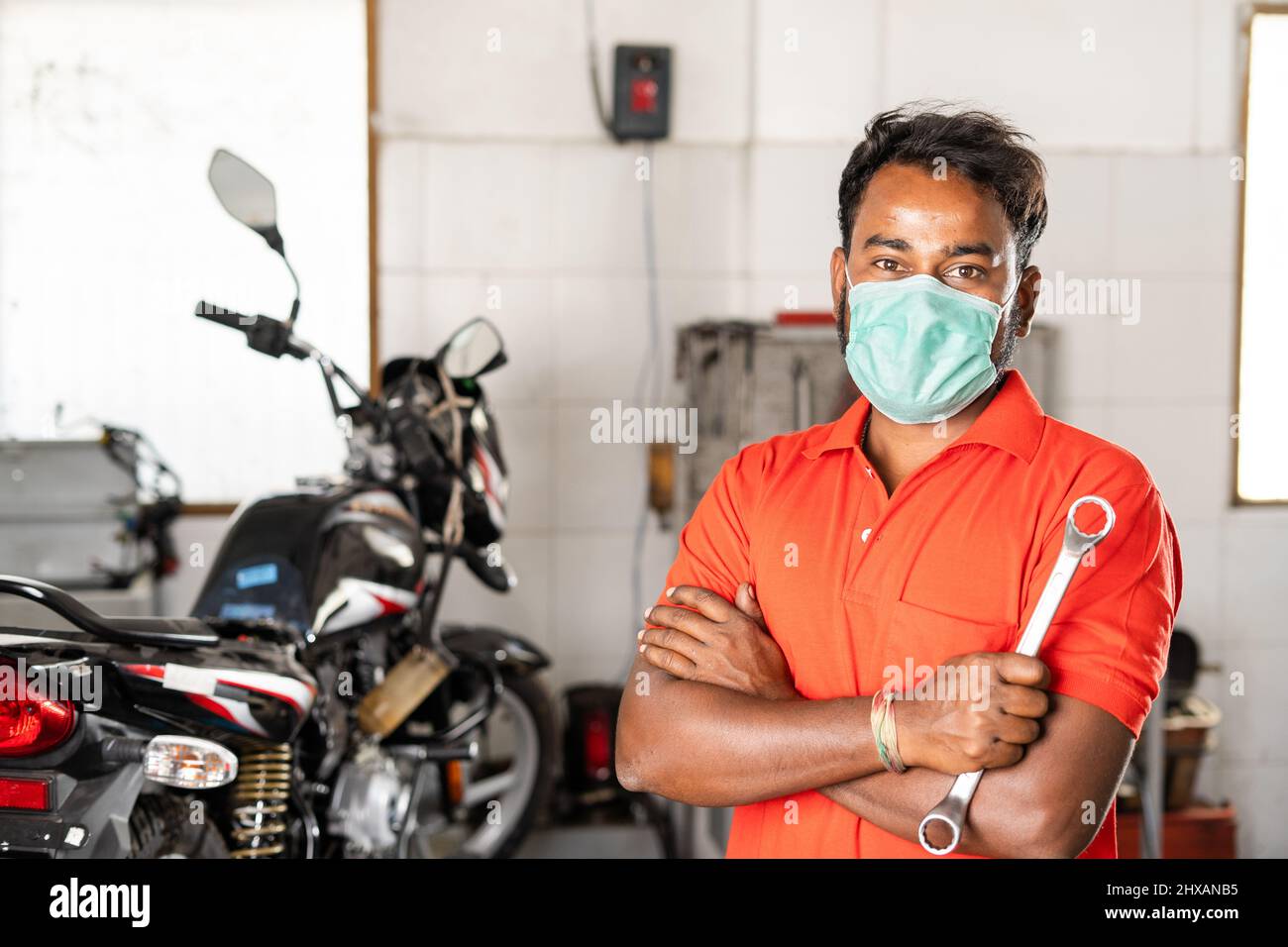 Mechanic standing in garage hi-res stock photography and images - Alamy