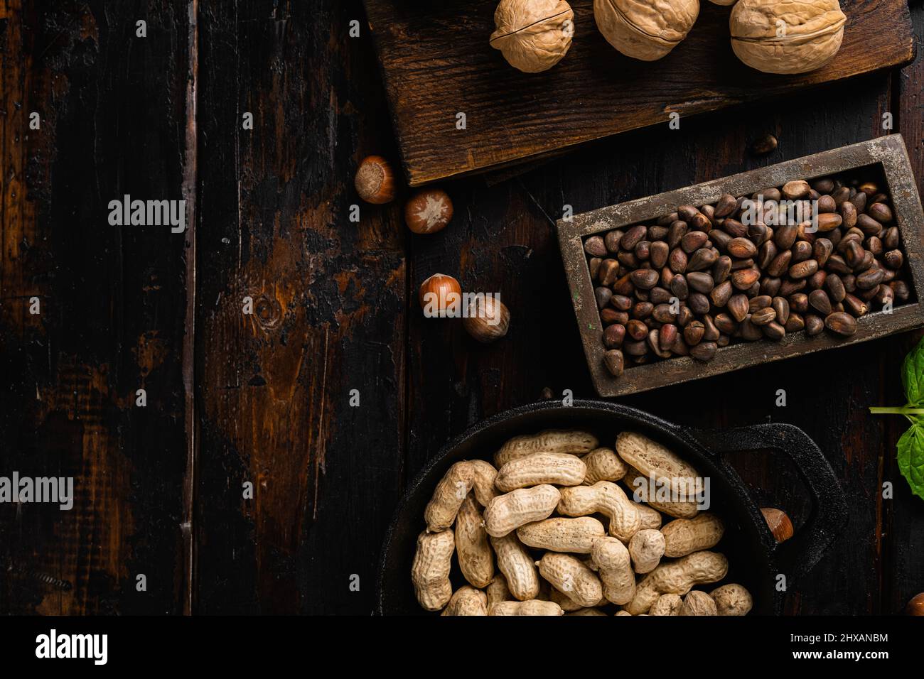 Pine nuts set, on old dark wooden table background, top view flat lay ...