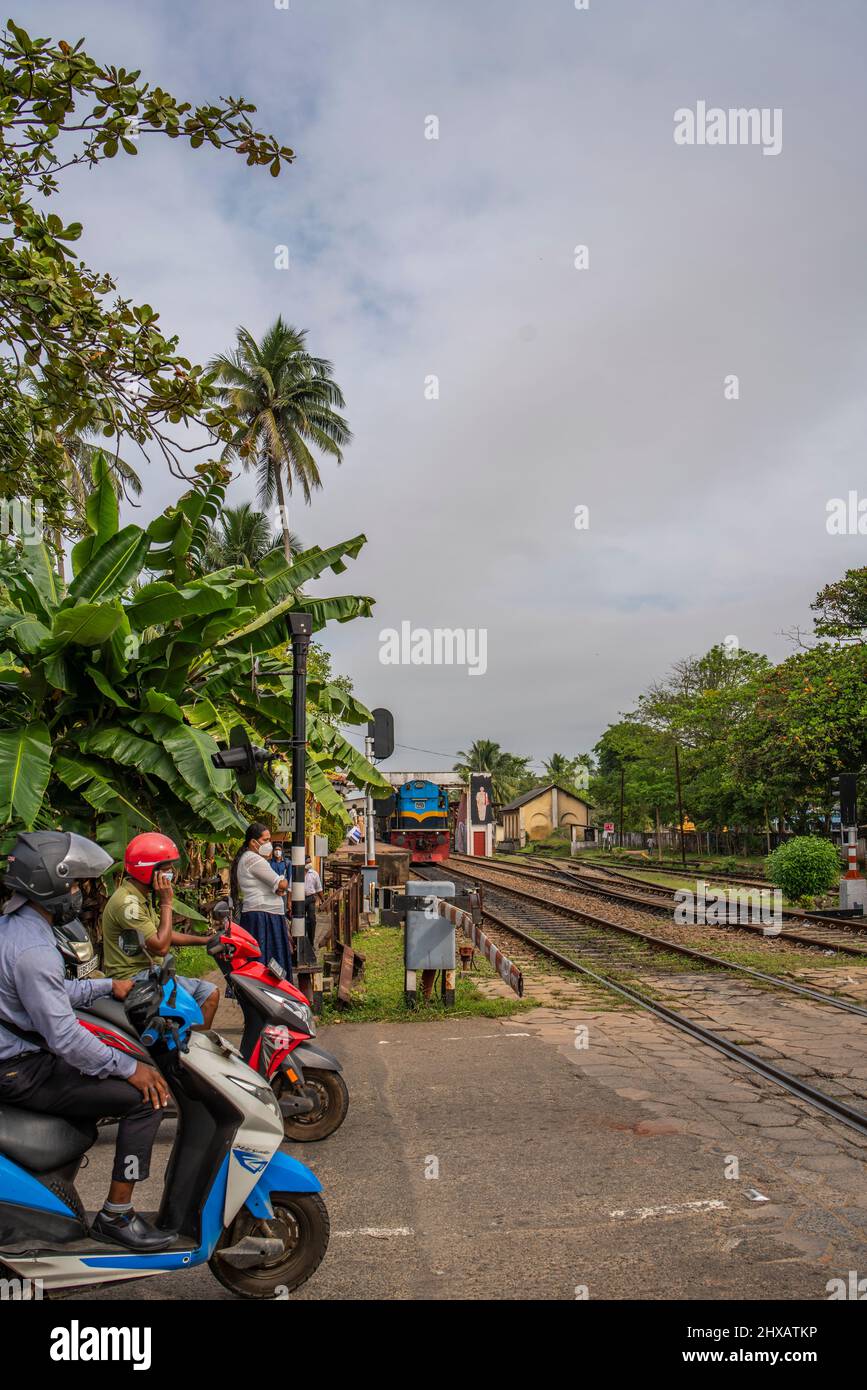 HIKKADUWA, SRI LANKA - JANUARY 04.2022: Passenger train arrives on ...