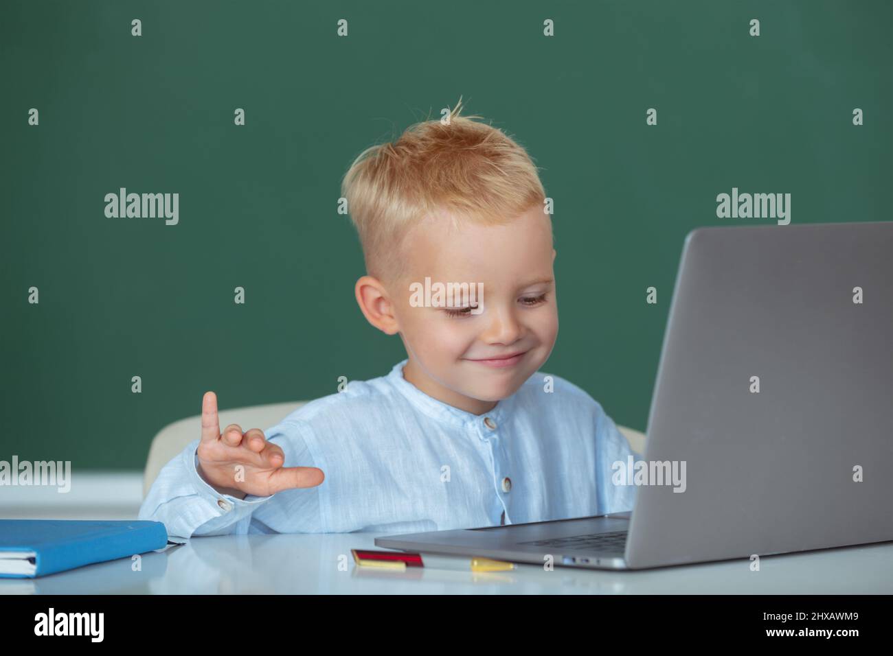 Happy child using gadgets to study. Computer education for kids. Funny ...