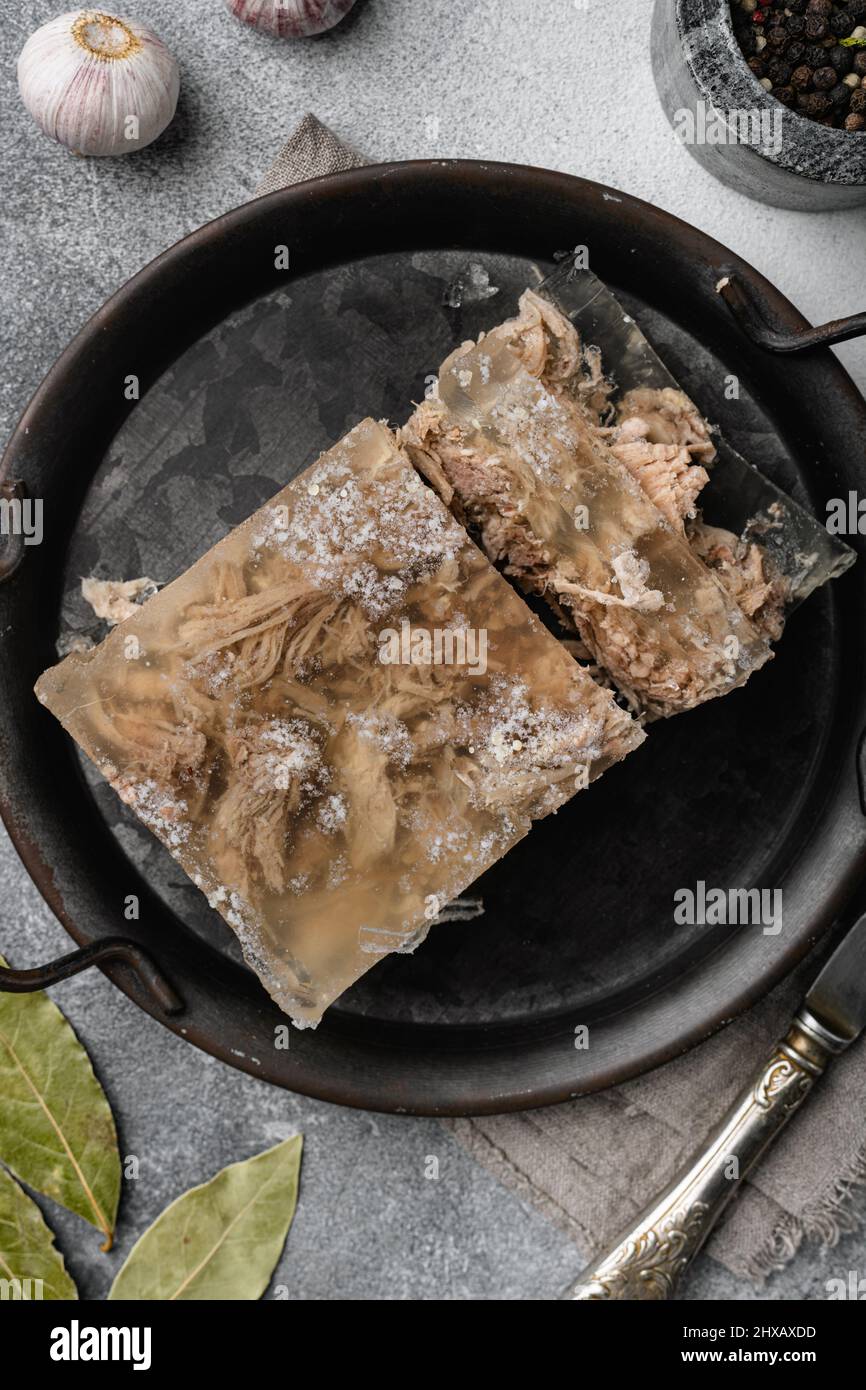 Jellied meat, beef aspic, traditional Russian dish set, on gray stone ...