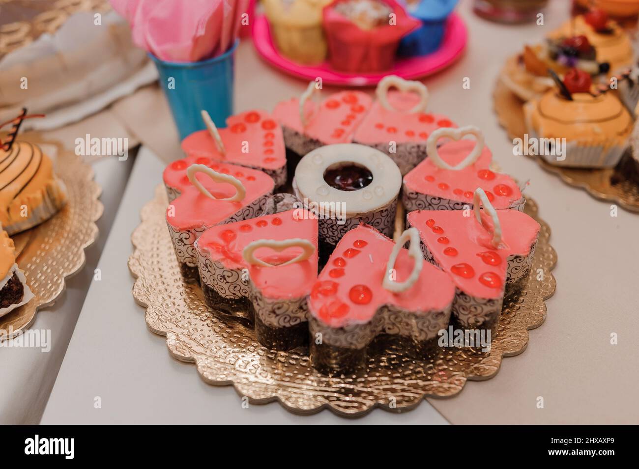 Sweet cakes at a wedding banquet. Catering, sweet festive buffet Stock ...