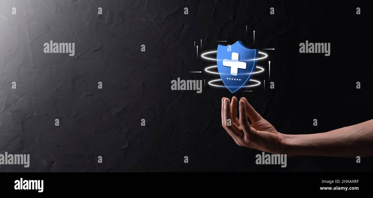 Businessman hold Shield with plus Low polygonal icon, medicine icon ...