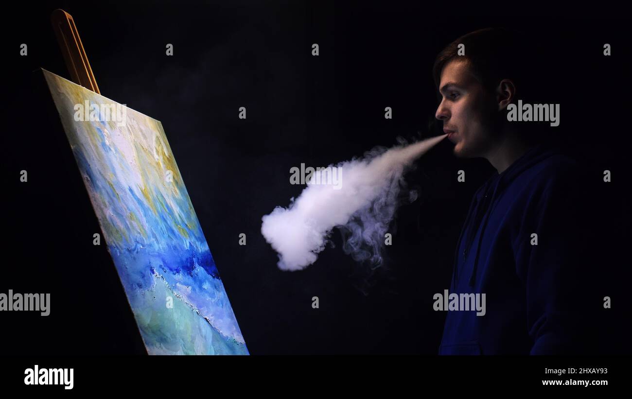 Artist copyist paint seascape with ship in ocean. Vaper smoke vape e ...