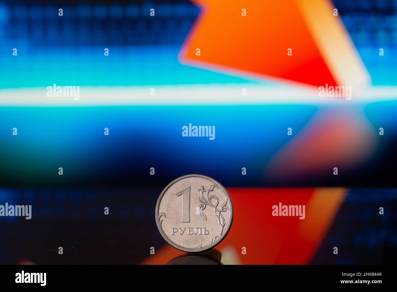 One ruble coins lies on RUB to USD currency chart. Crisis in the ...