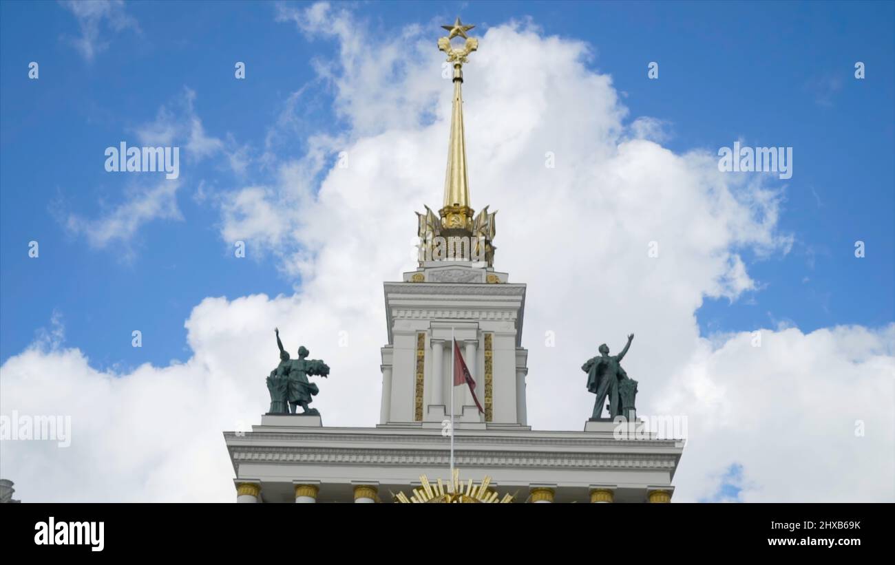 Top of architectural building with statues and gold star. Action ...