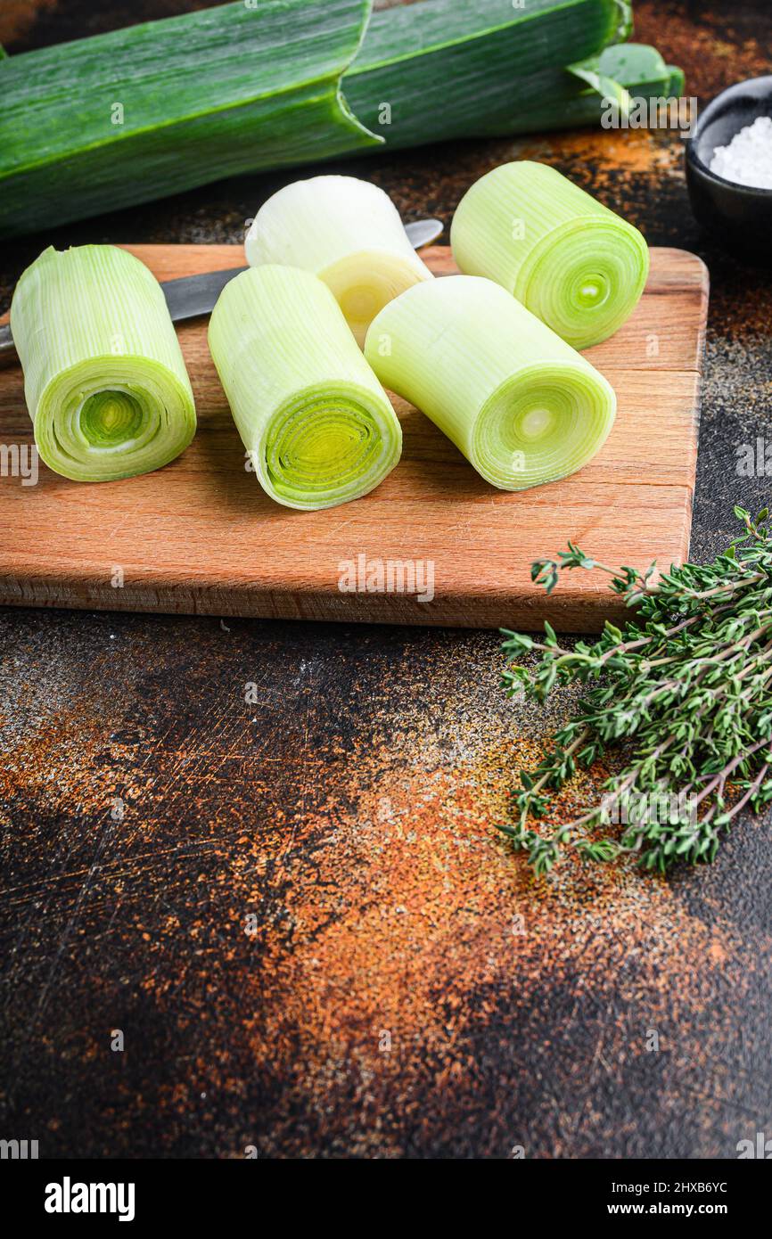 Organic chopped leek for cooking Braised Leeks on wooden board with ...