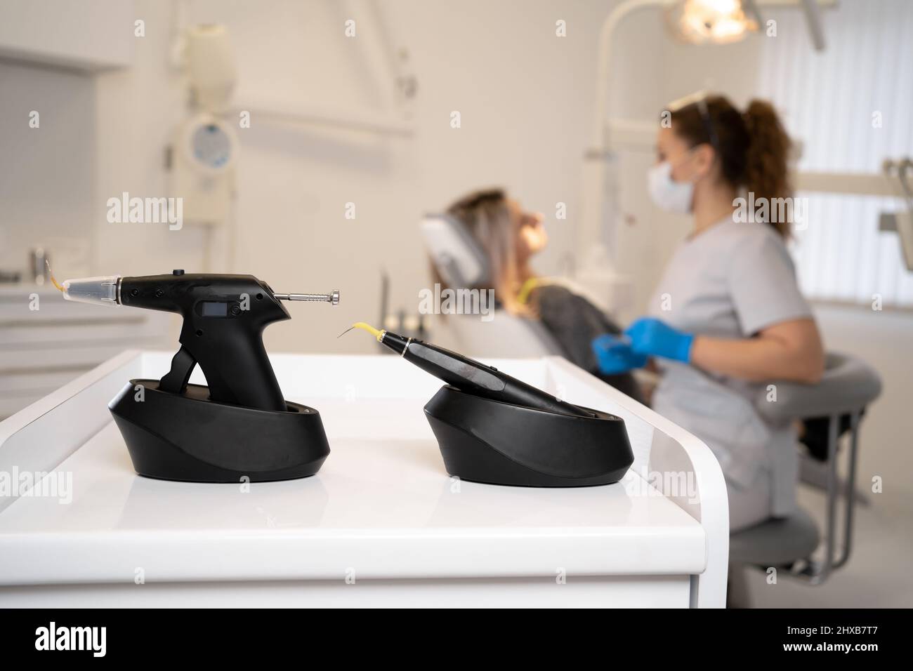 Cordless root canal filling tool injector gun. selective focus. copy ...