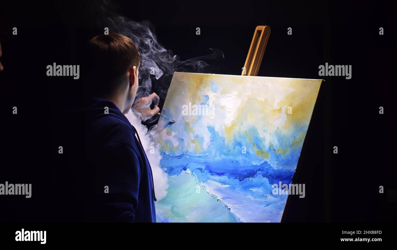 Artist copyist paint seascape with ship in ocean. Vaper smoke vape e ...