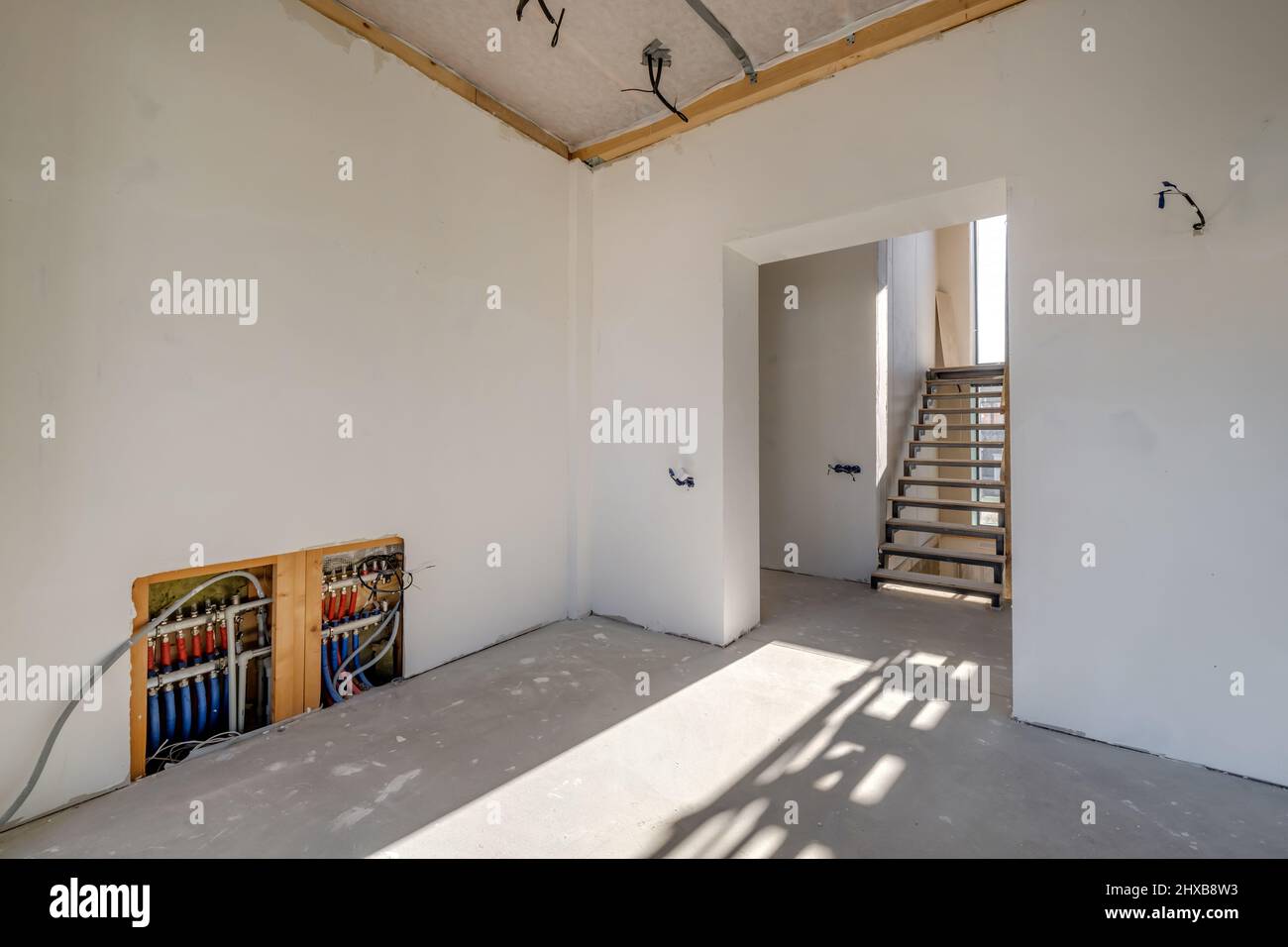 empty white room without repair and furniture with scaffolding with ...