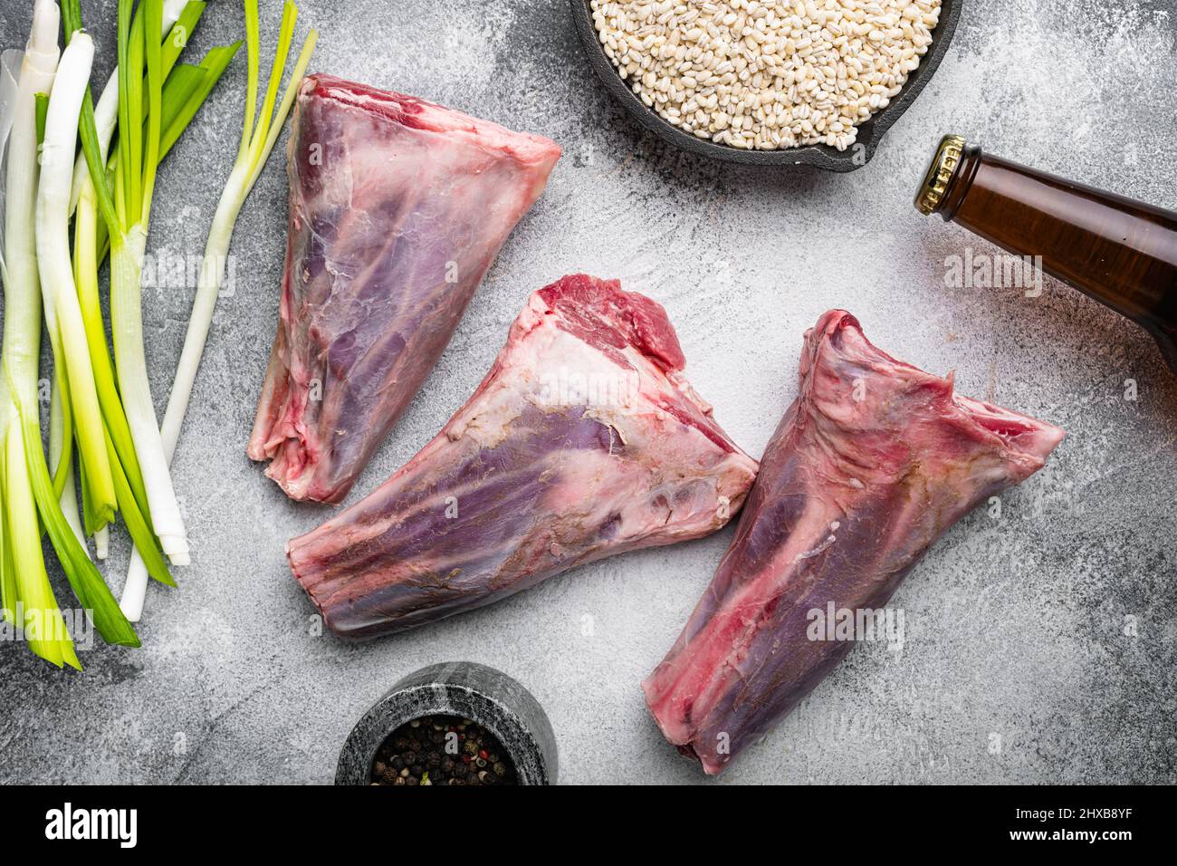 Uncooked lamb shank set, on gray stone table background, top view flat ...