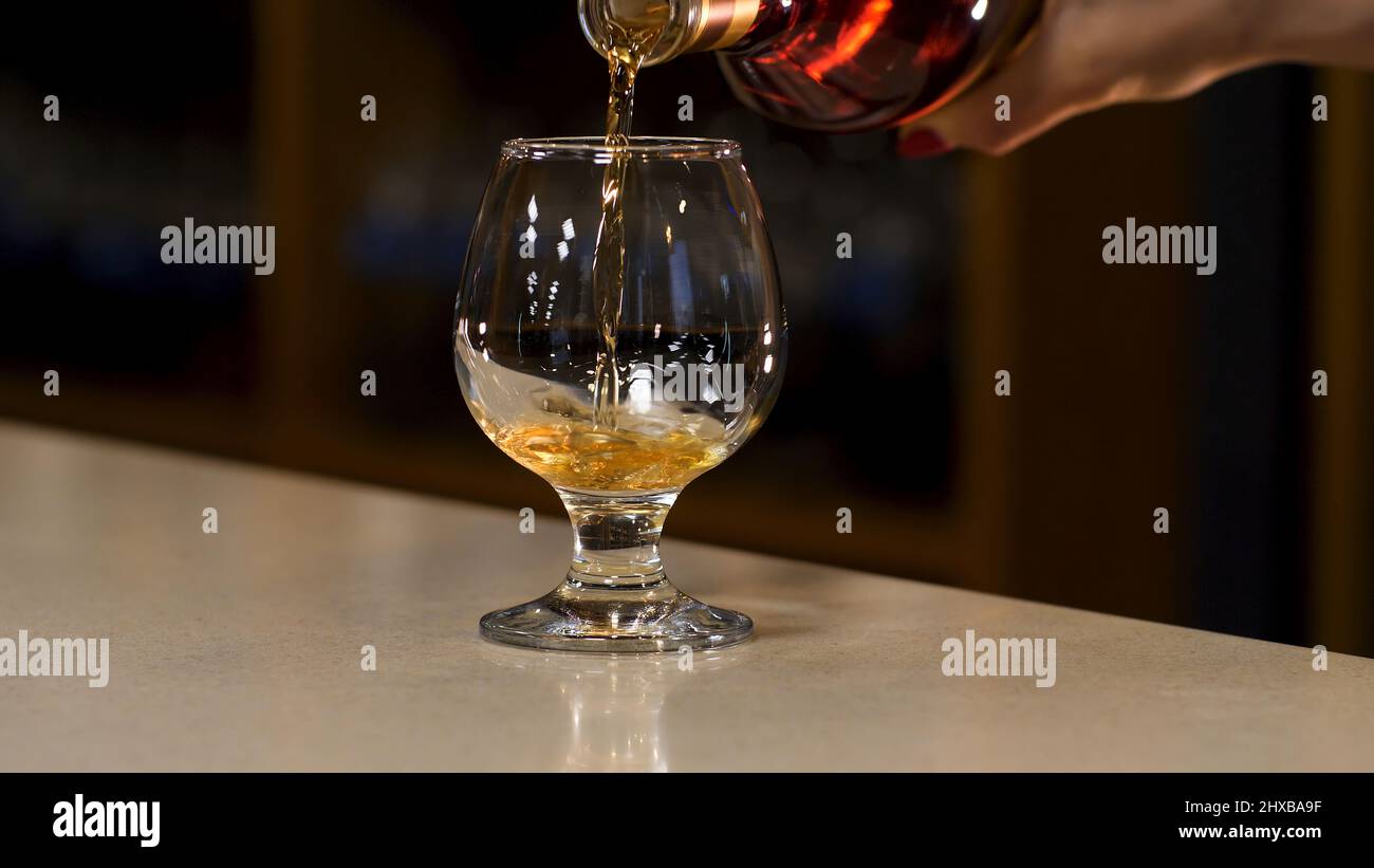 Hand pouring liquor isolated hi-res stock photography and images - Alamy