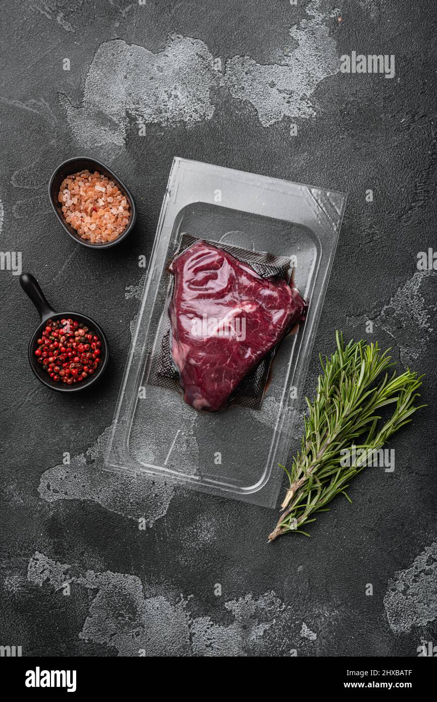 Beef rump steak pack set, on black dark stone table background, top ...