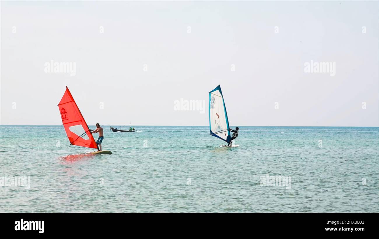 Windsurfer rides among the huge tubes and waves of the Indian Ocean on ...
