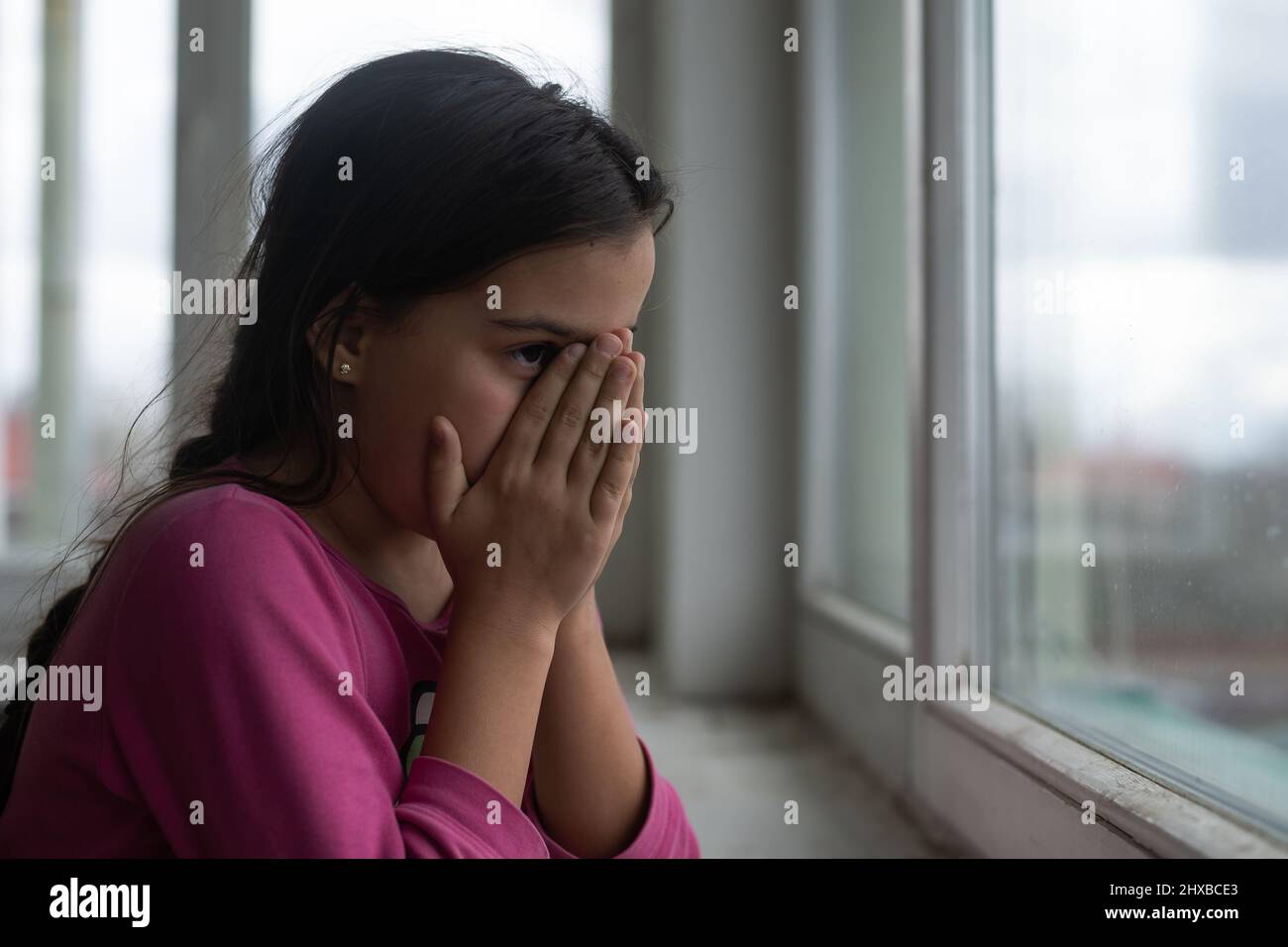 little girl praying near the window Stock Photo - Alamy