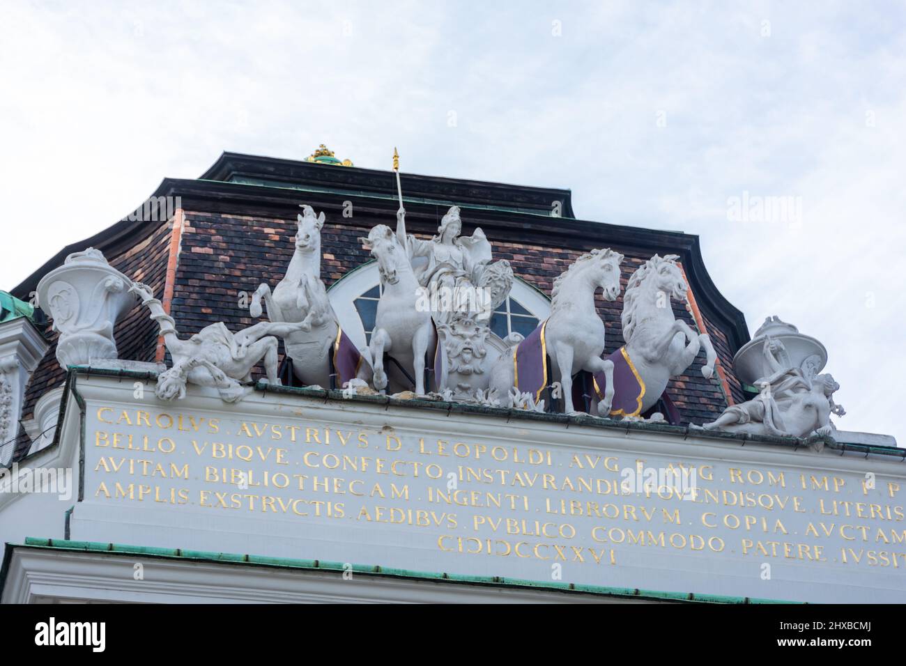 Old statue representing Athena and some horses on the top of Hofburg ...