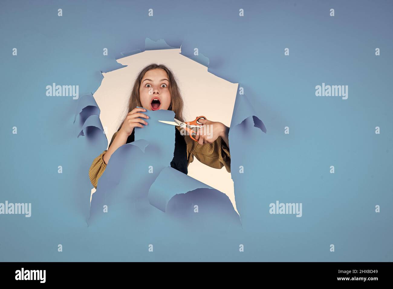 happy teen girl cut paper with scissors, copy space, creativity Stock ...