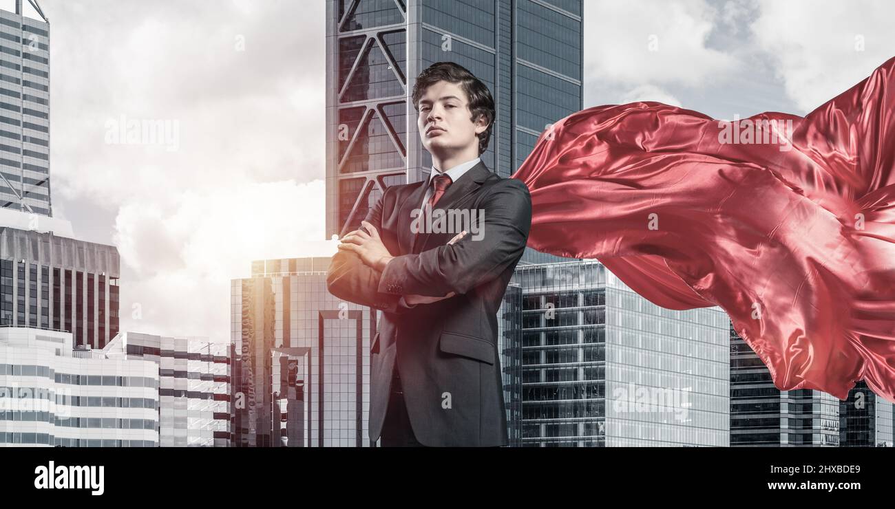Concept of power and sucess with businessman superhero in big city ...