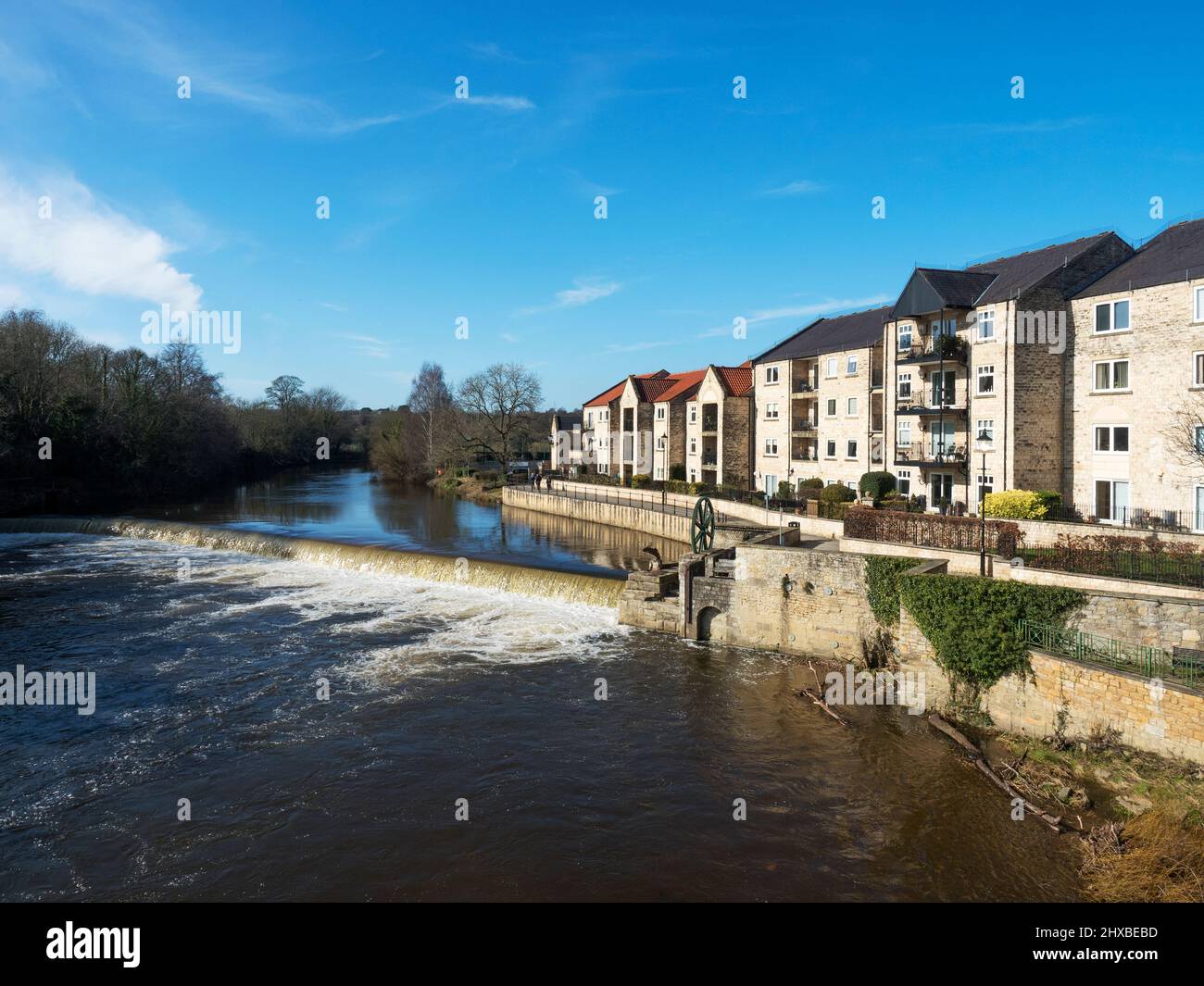Weir on the River Wharfe and riverside apartments at Wetherby West ...