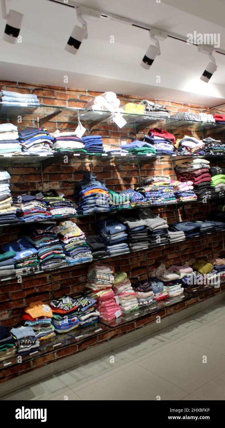Colorful women's dress in clothing store, selective focus with blur and ...