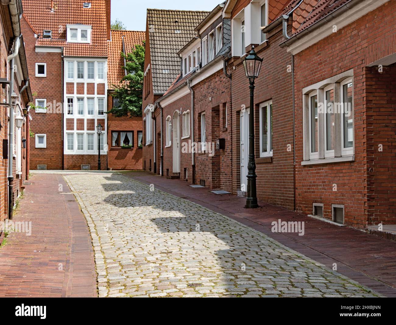 Street with brick houses in the old town of the East Frisian city of ...