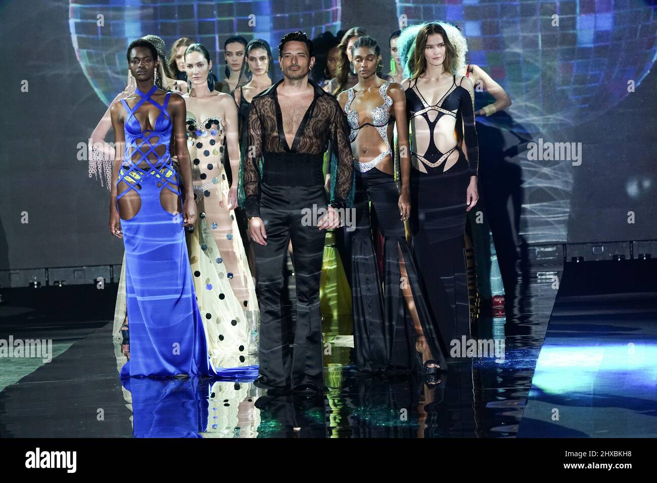 Madrid, Spain. 11th Mar, 2022. Models walk the runway at the Andres ...