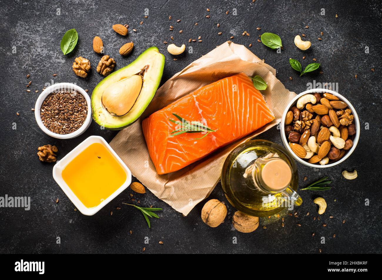 Healthy fats products at black background Stock Photo - Alamy
