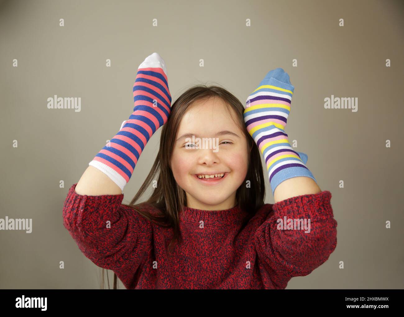 Beautiful girl with different socks Stock Photo - Alamy