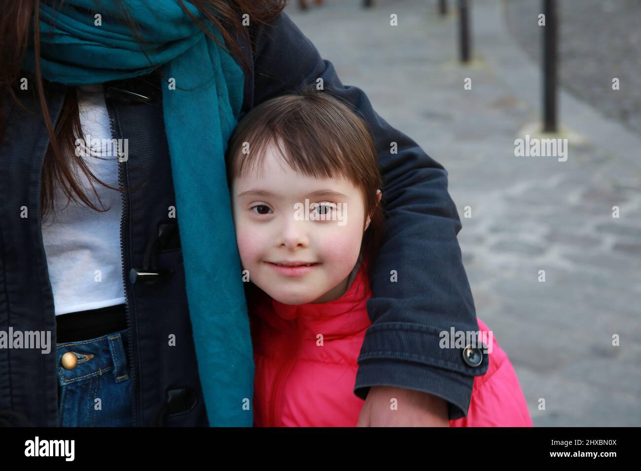 Portrait of little girl with parent Stock Photo - Alamy