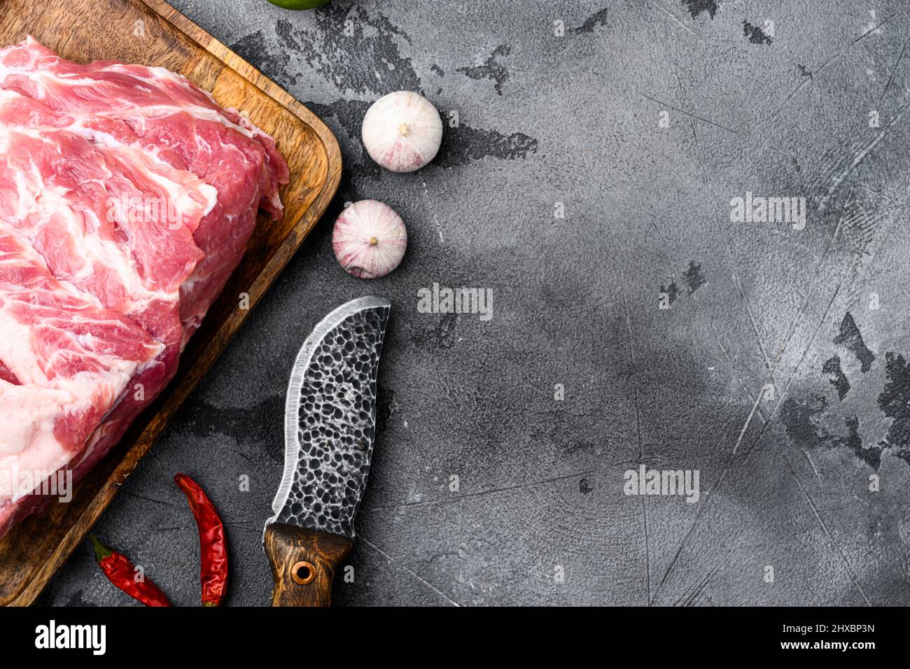 Piece of fresh raw pork from the neck set, with ingredients and herbs ...