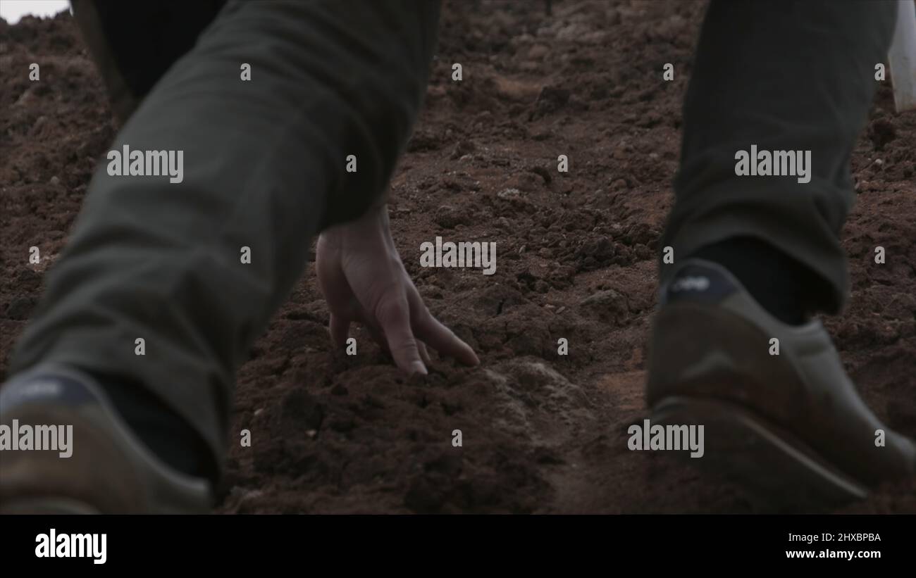 Close up of hiking boots and legs climbing up rocky trail. Footage ...