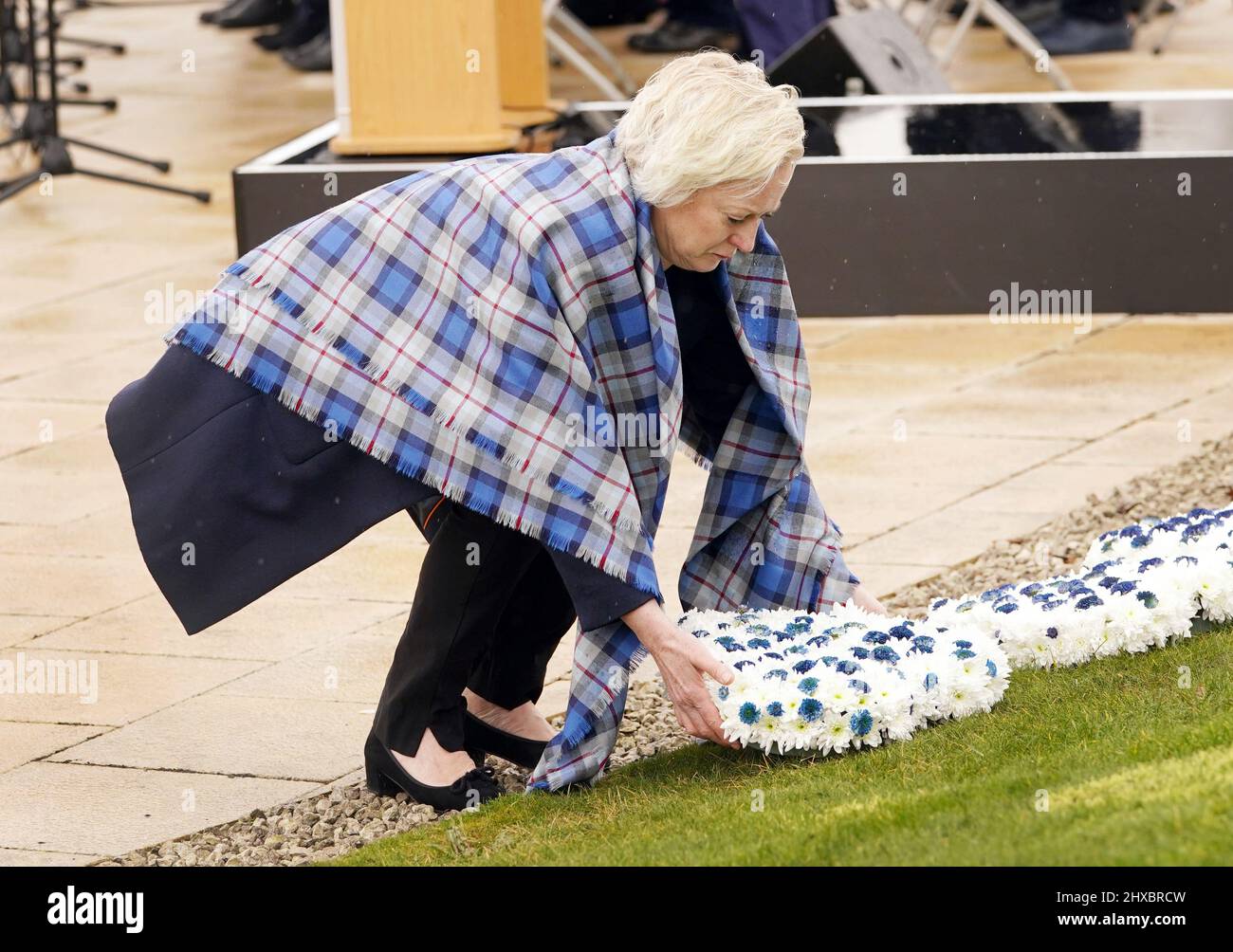 Chief Nursing Officer Ruth May lays a wreath during a pandemic ...