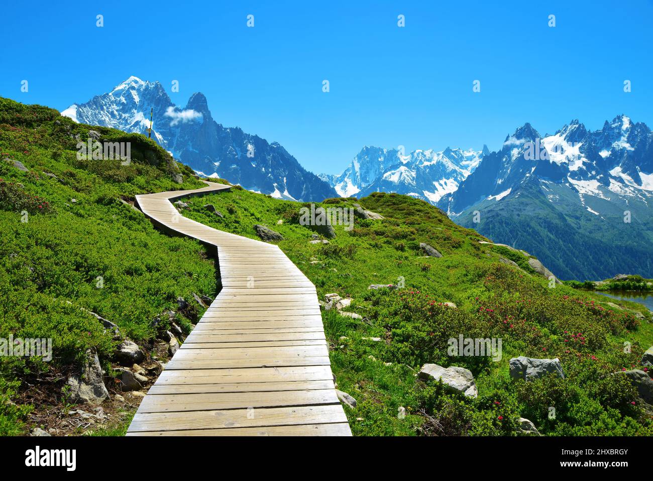 Wooden walkway in the mountain landscape. Nature Reserve Aiguilles ...
