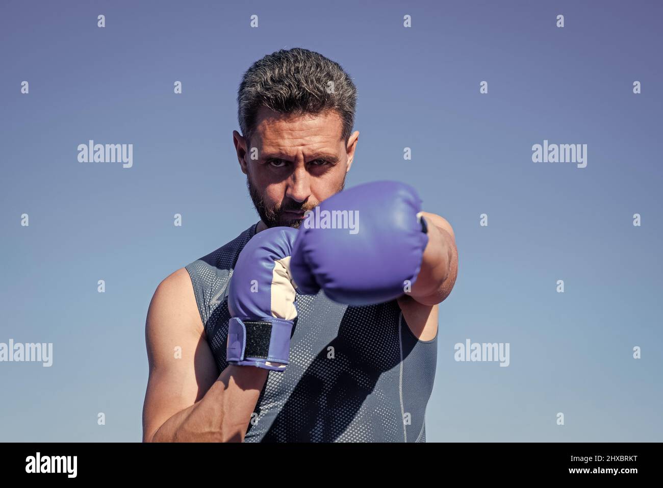 man boxer punching. fitness gym outdoor. muscular athletic guy training ...