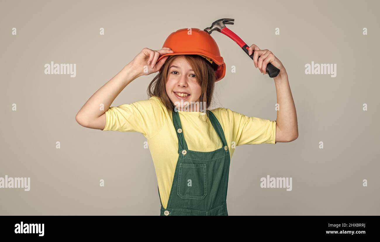 examining. renovation and repair. using working tool. teen girl in ...